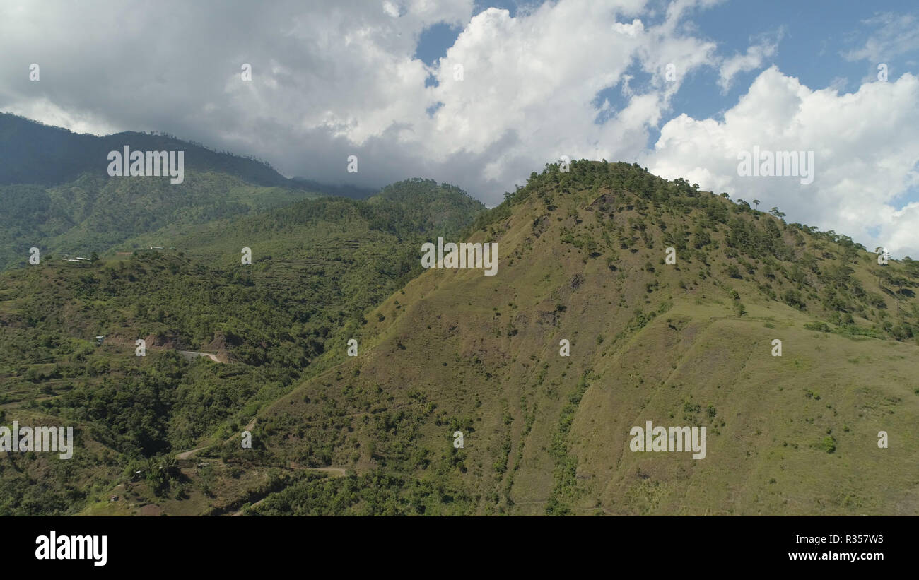 Aerial view of mountains covered forest, trees against the sky and ...
