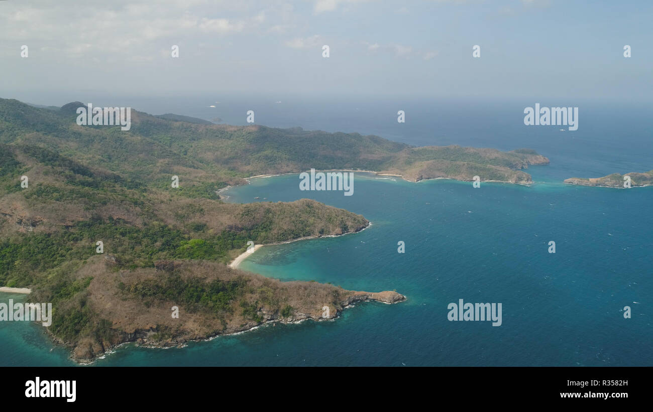 Aerial view of seashore with beach, lagoons and coral reefs ...