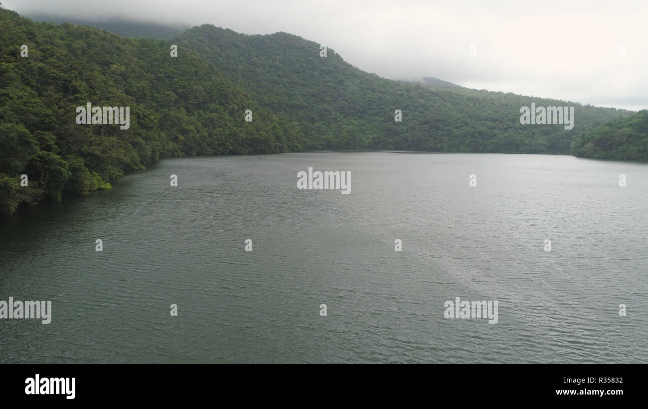 Aerial view of lake Bulusan in the mountains with green rain forest ...