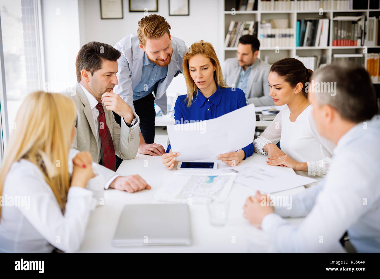 Group of business people working as team in office Stock Photo - Alamy