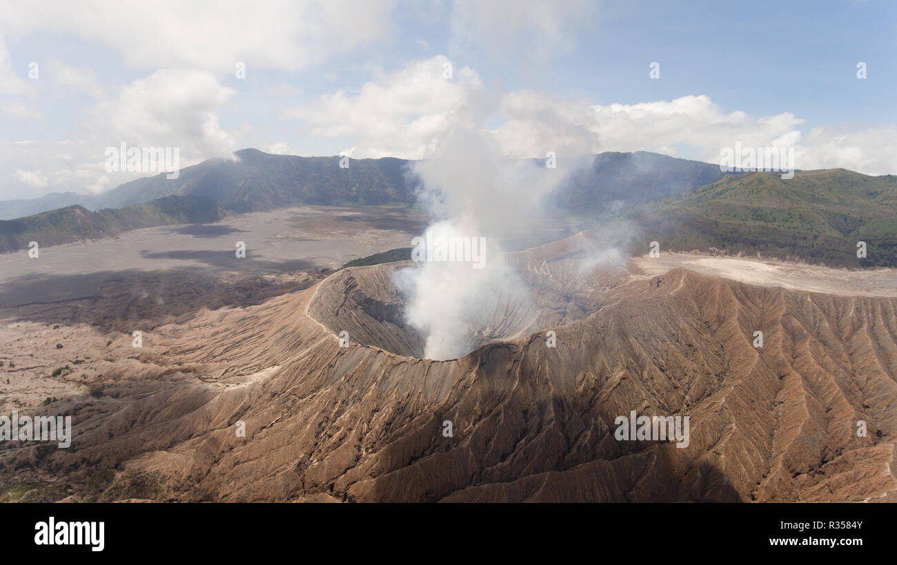Crater with active volcano smoke in East Jawa, Indonesia. Aerial view ...