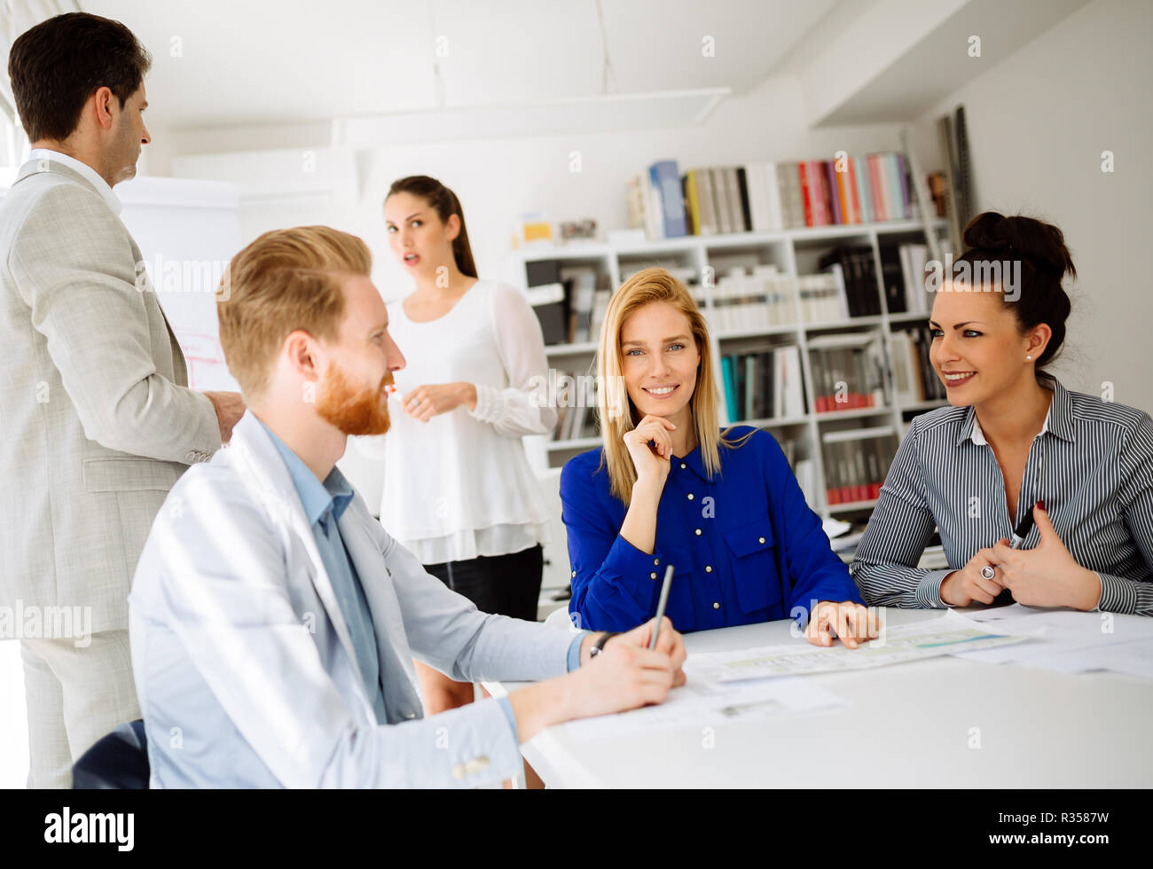 Business people having a board meeting Stock Photo - Alamy