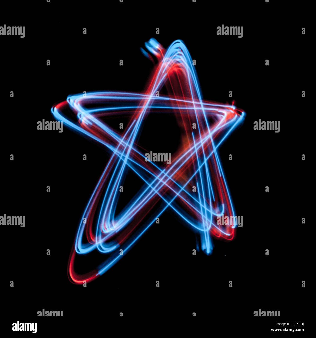 The neon star of light on black Stock Photo - Alamy