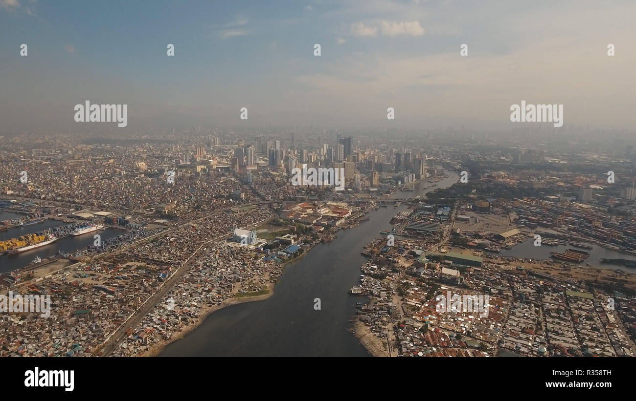 Aerial view skyline of Manila city. Fly over city with skyscrapers and ...