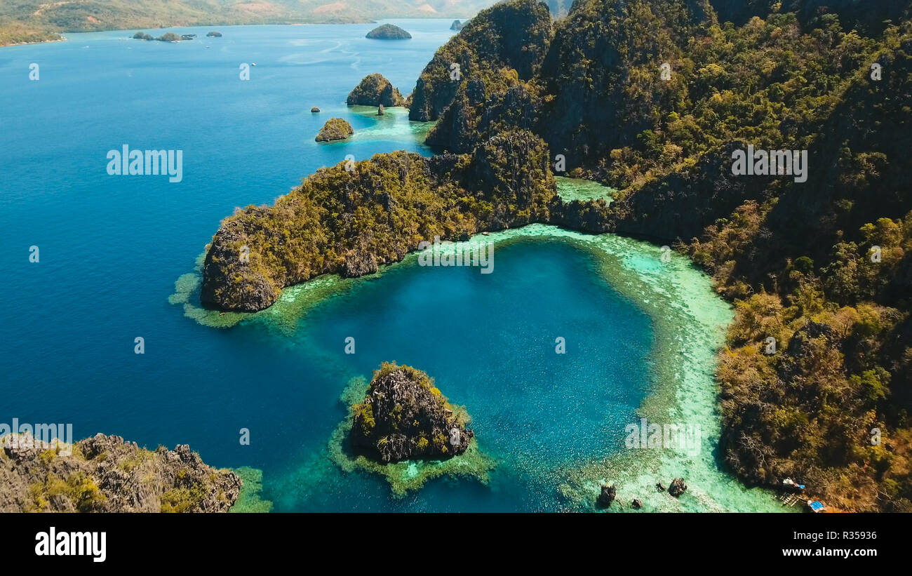 Tropical lagoon with azure water, beach by the Kayangan Lake ...