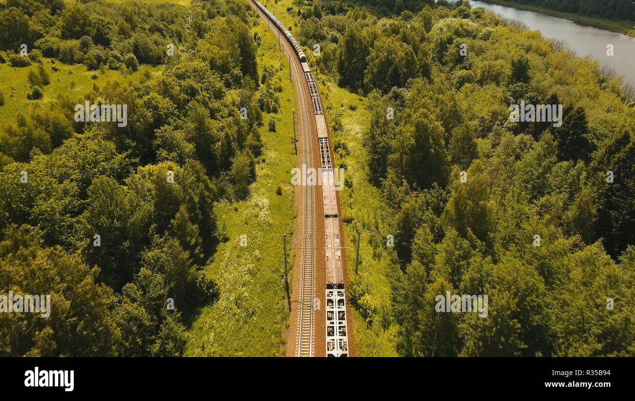 Freight train with cisterns and containers on the railway. Aerial view ...