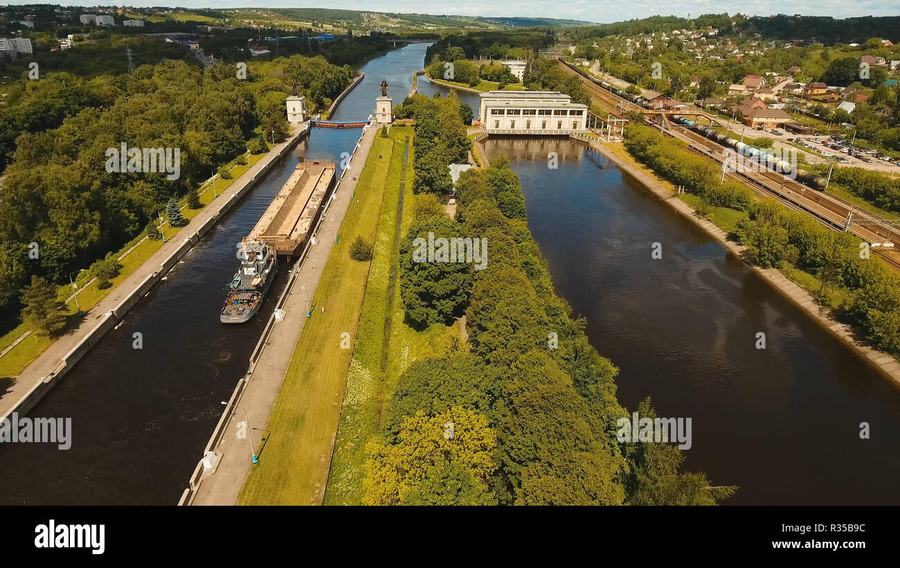 Sluice Gates on the River. Aerial view barge, ship in the river gateway ...