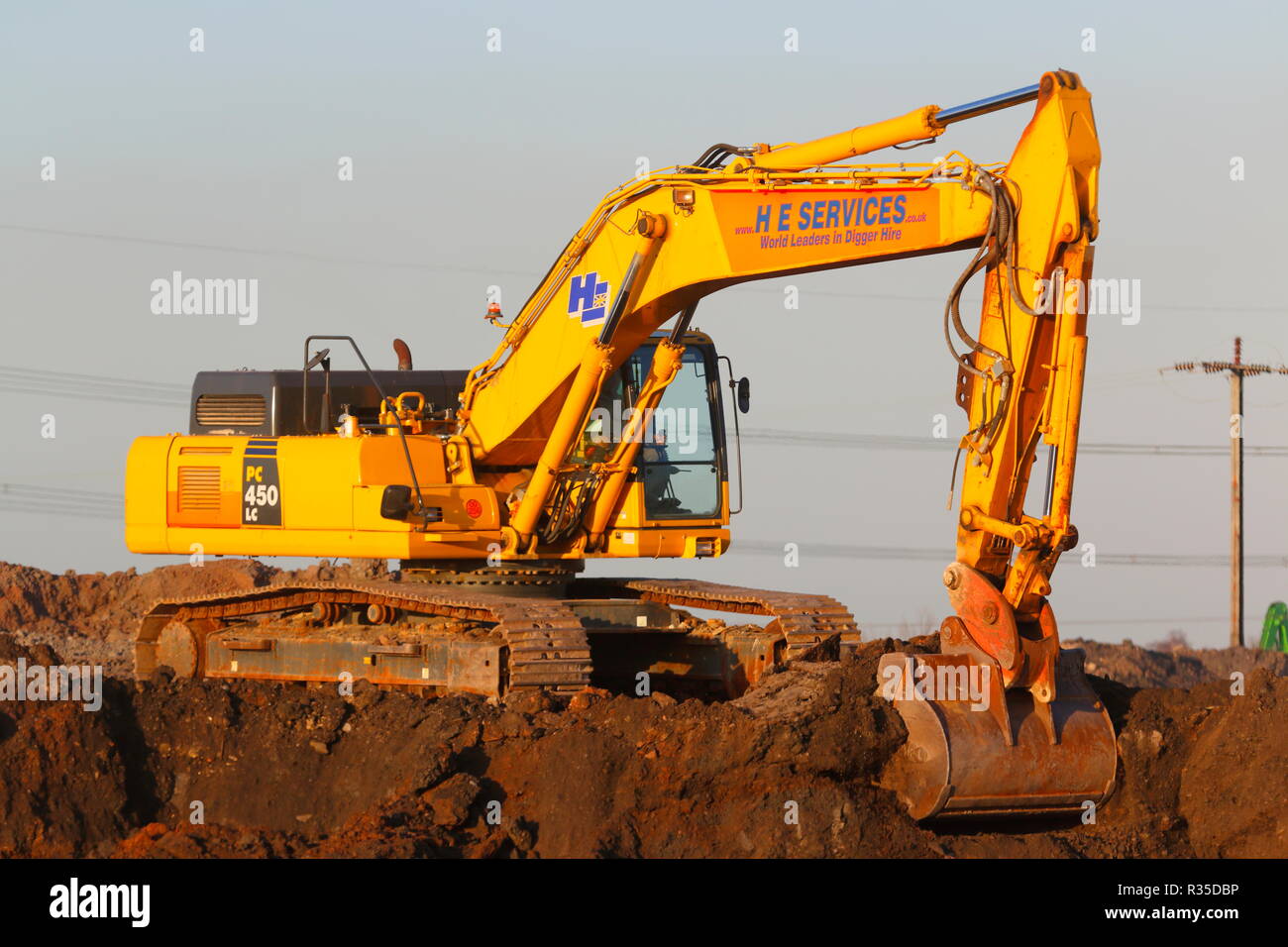 A Komatsu 450 backhoe used for loading material onto trucks on the ...