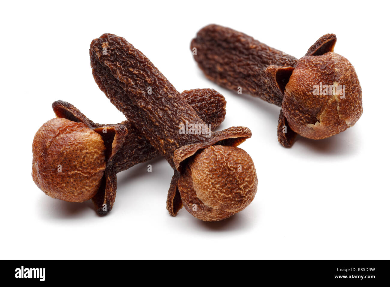 Three cloves isolated on white background Stock Photo - Alamy