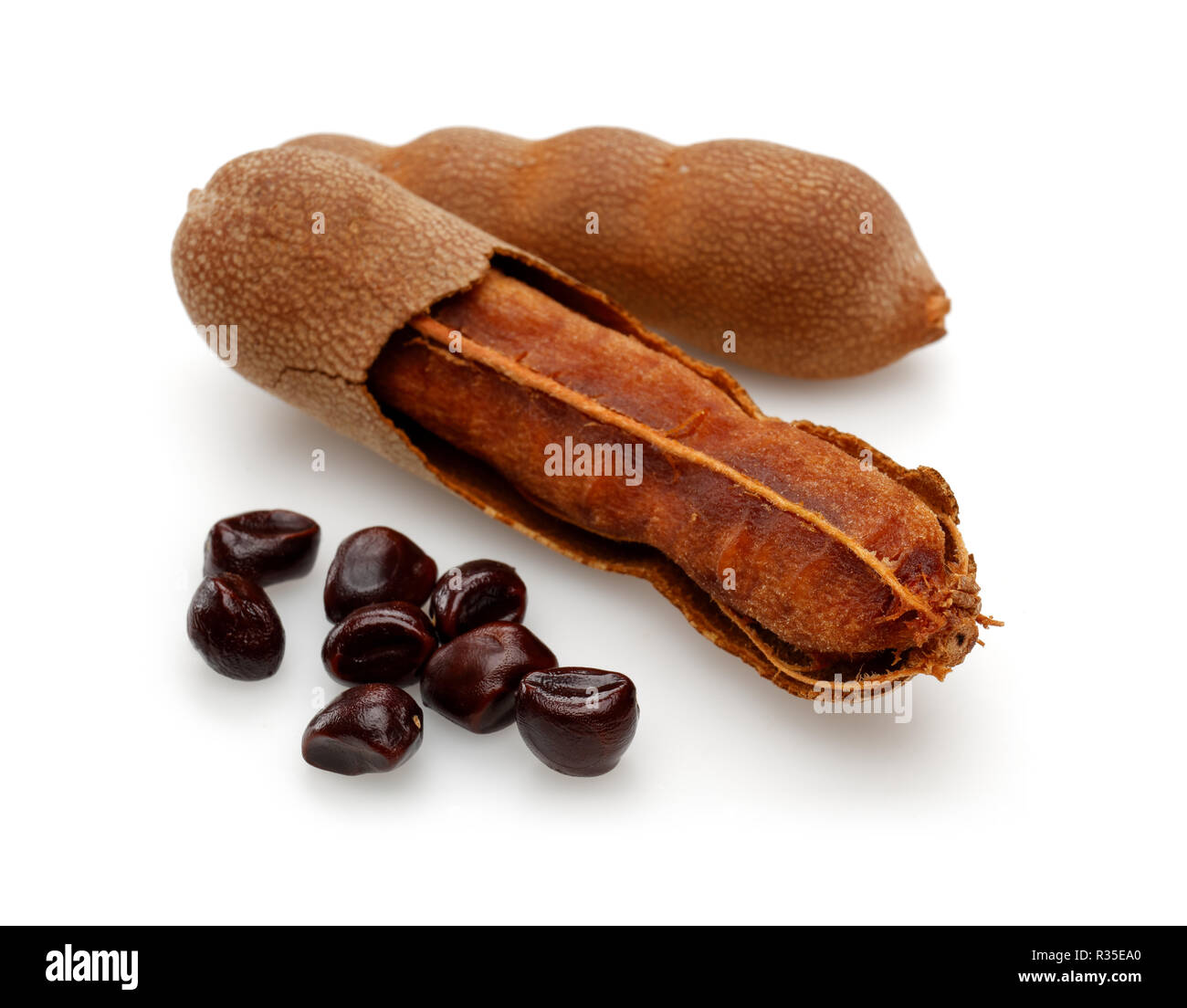Tamarind fruit and seeds isolated on white background Stock Photo - Alamy