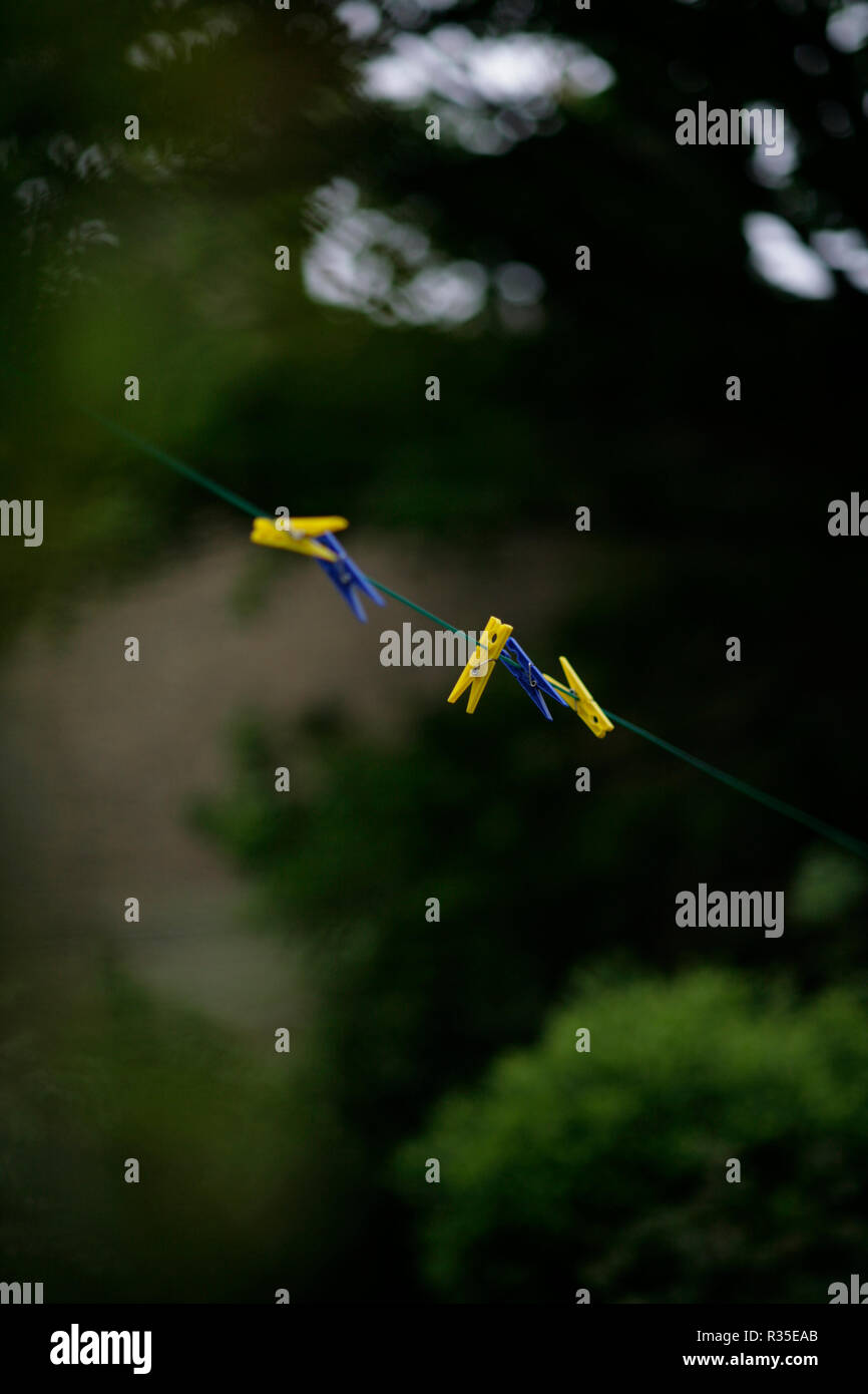 Pegs on a washing line Stock Photo - Alamy