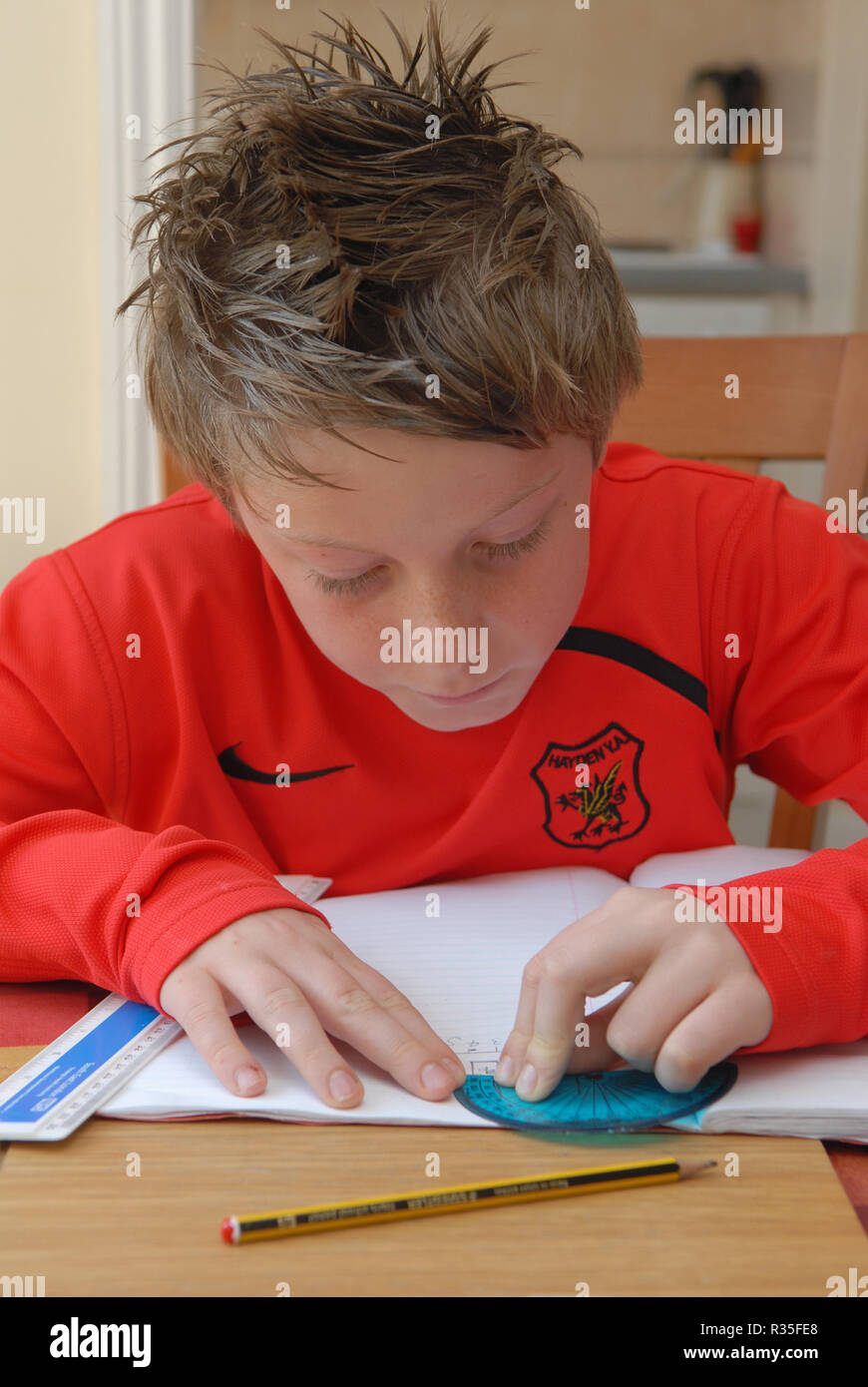 Adolescent do homework at home hi-res stock photography and images - Alamy