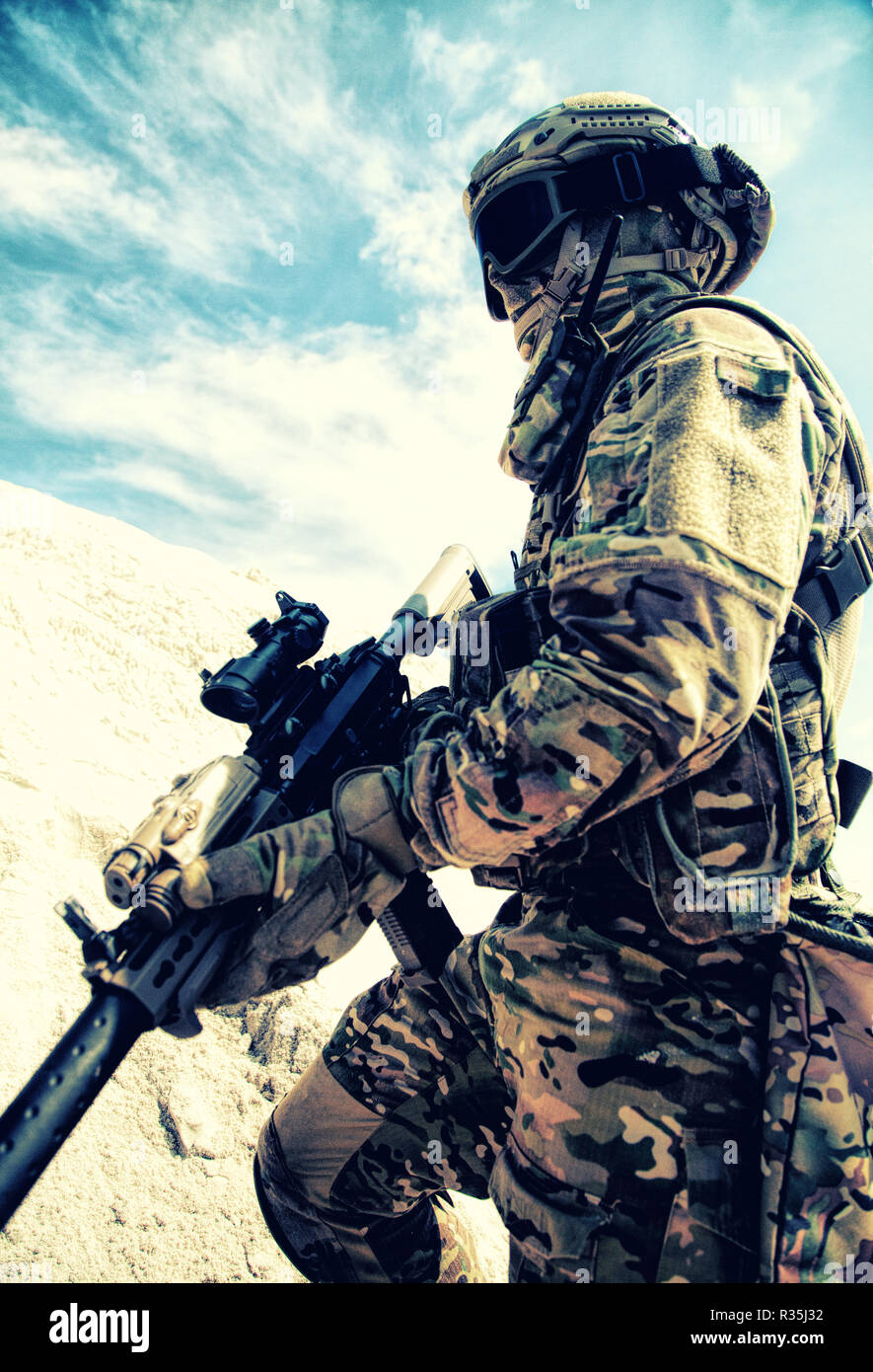 Airsoft, strikeball player in camouflage uniform with military tactical ...