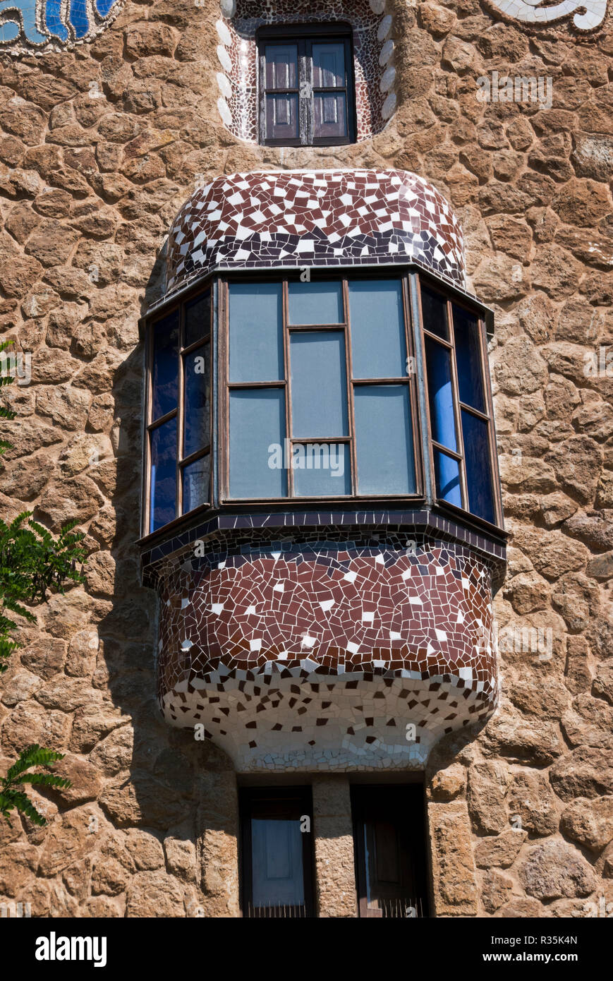 A window from the Pavilion at the Park Guell designed by Antoni Gaudi ...