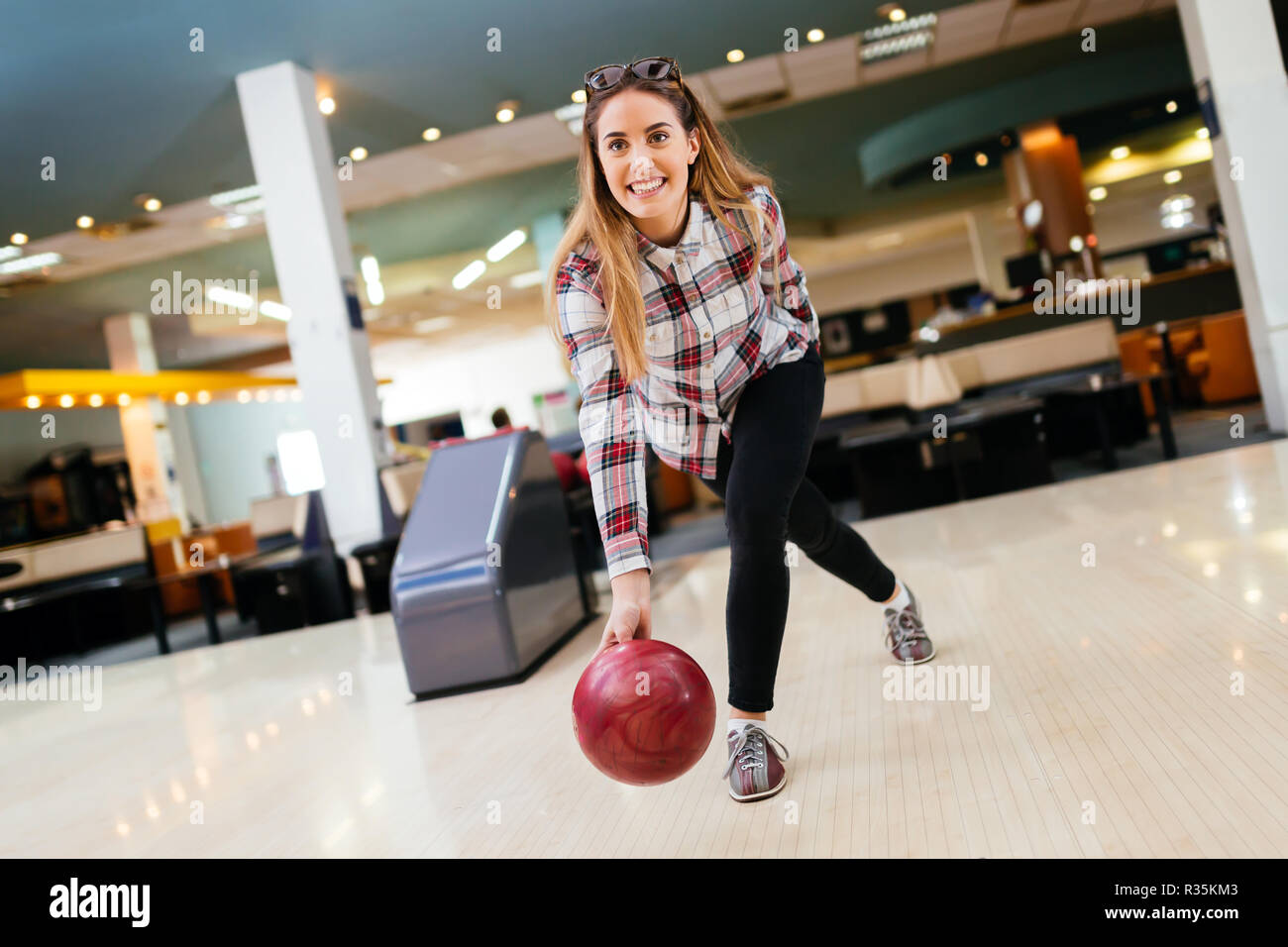 Beautiful woman bowling Stock Photo - Alamy