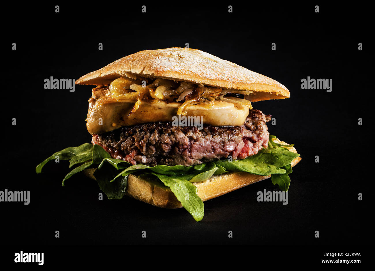 Burger isolated in black background Stock Photo - Alamy