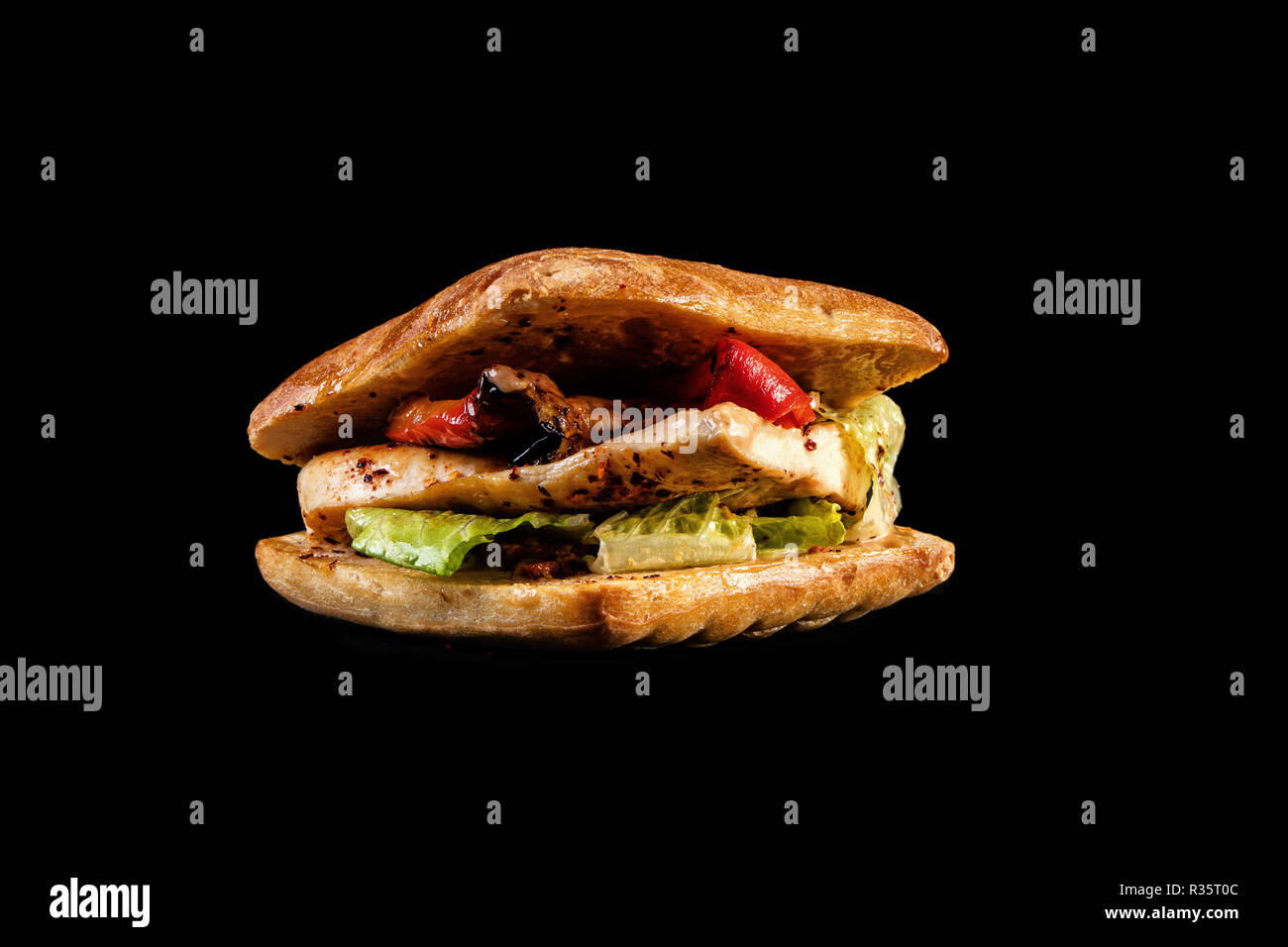 Burger isolated in black background Stock Photo - Alamy