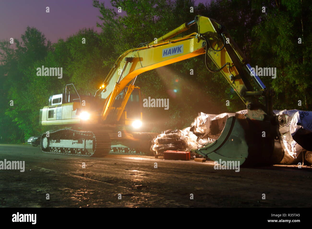 A Komatsu backhoe parked in the compound on the FARRRS link road ...