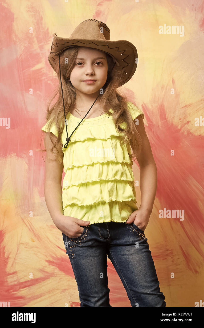 pretty little girl with cute face in american western cowboy hat on ...