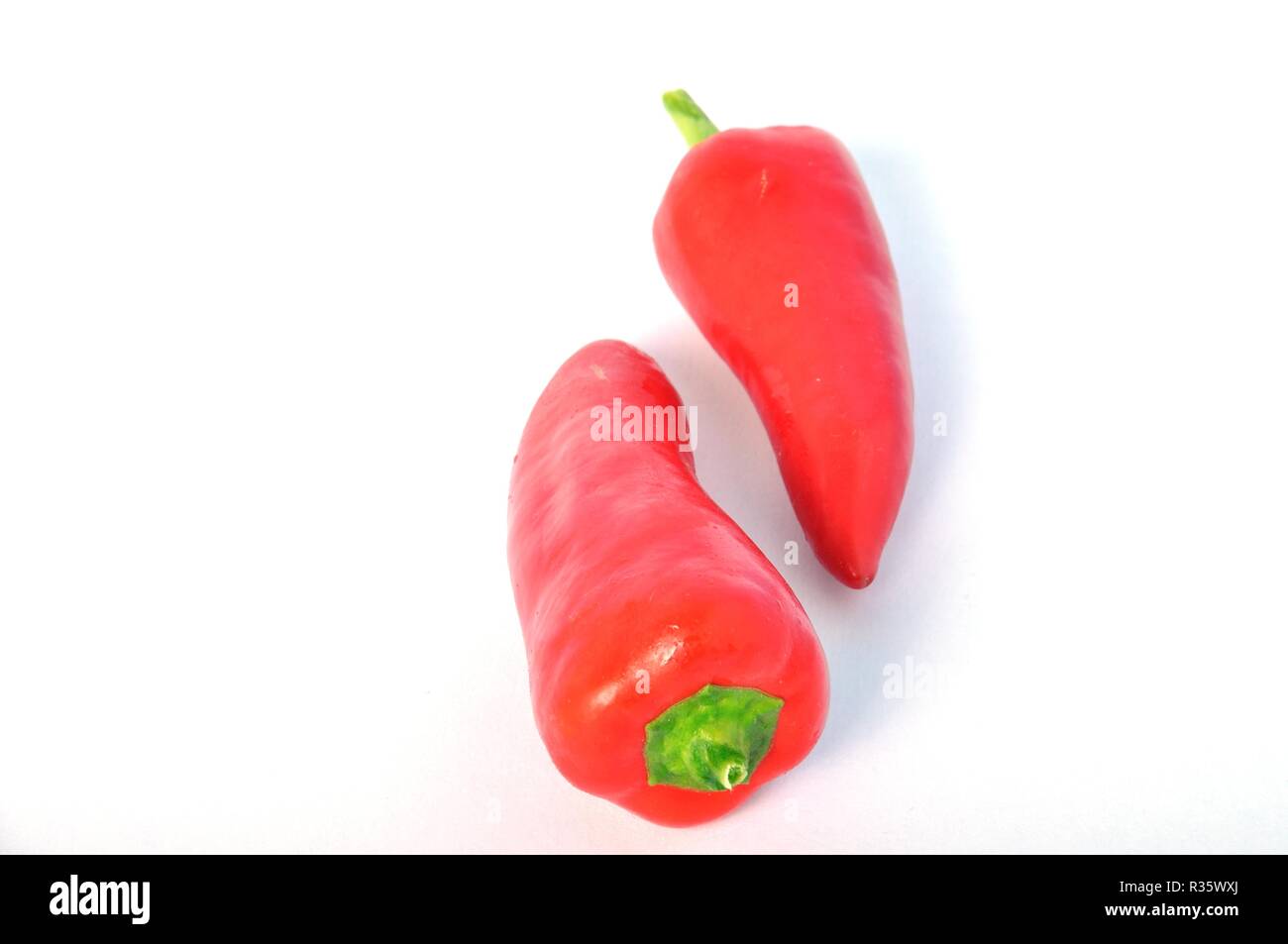 Red long pepper on white bacground Stock Photo - Alamy