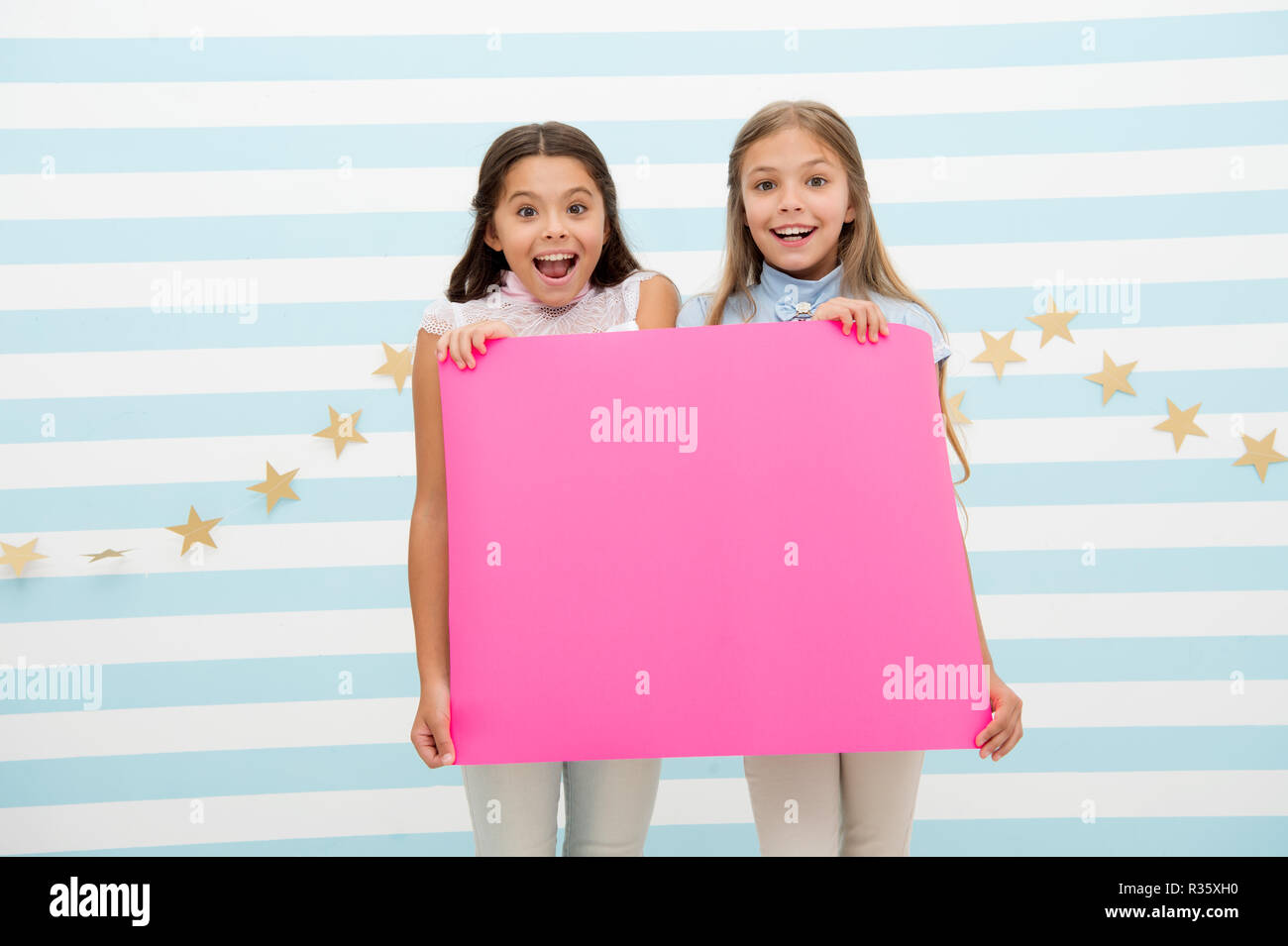 Amazing surprising news. Girl hold announcement banner. Girls kids ...