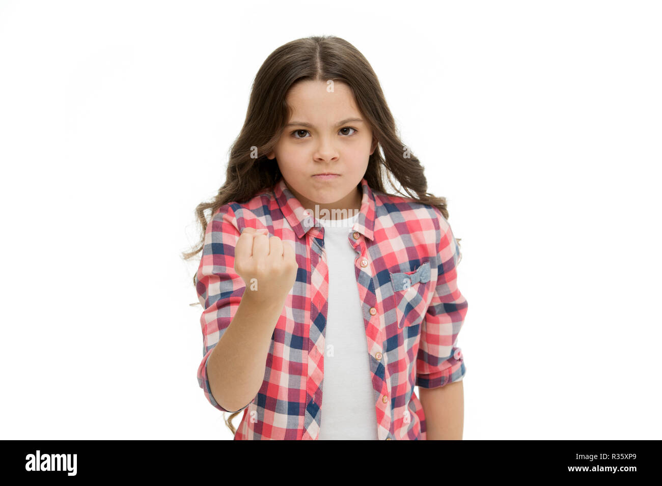 Girl kid threatening with fist isolated on white. Strong personality ...