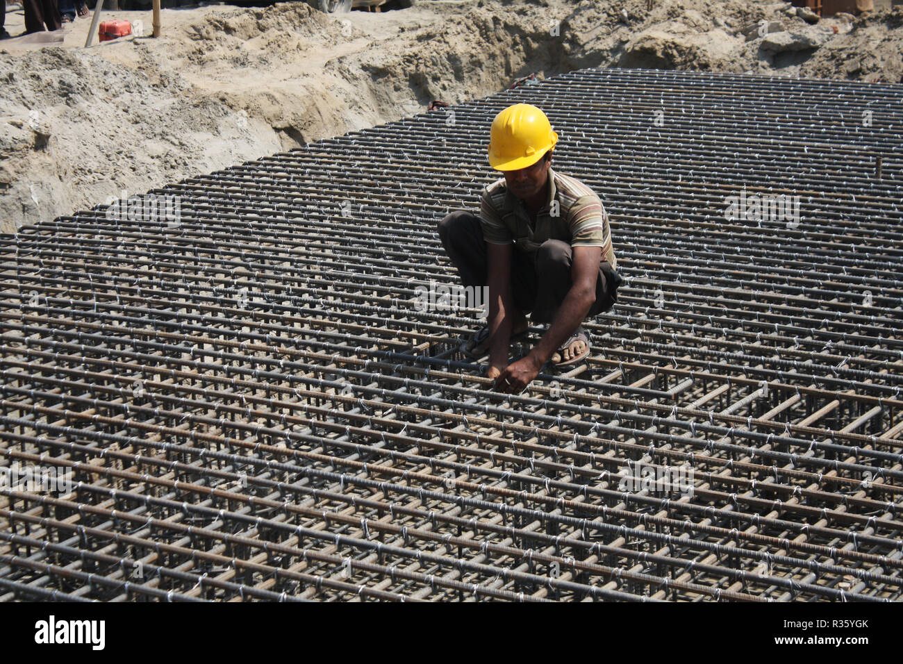 A Bangladeshi labor works in a Construction site in Dhaka, Bangladesh ...