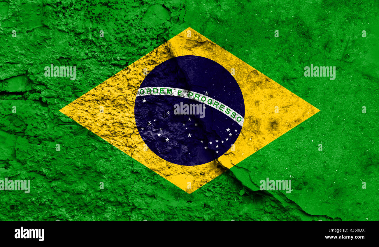Flag of Brazil close up painted on a cracked wall, concept of armed ...