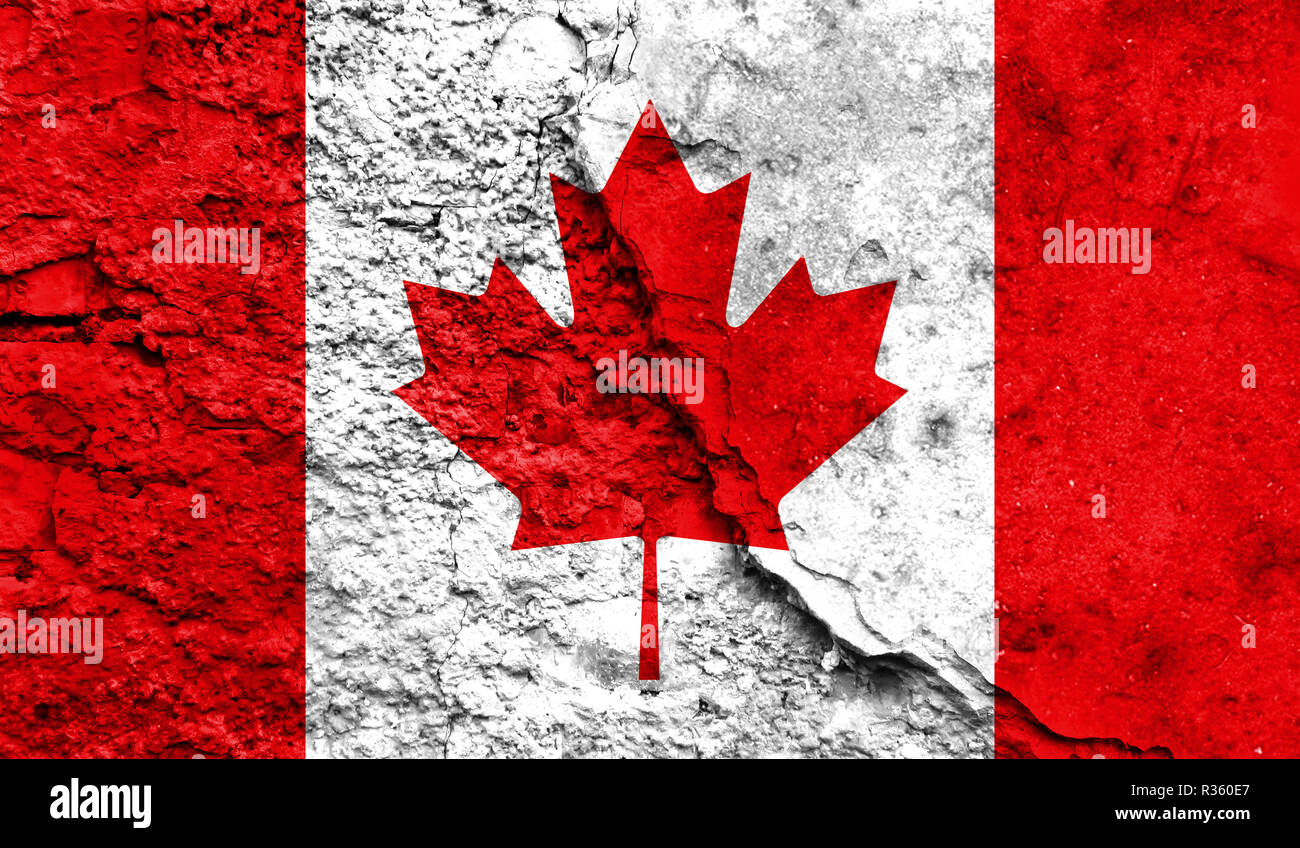 Flag of Canada close up painted on a cracked wall, concept of armed ...