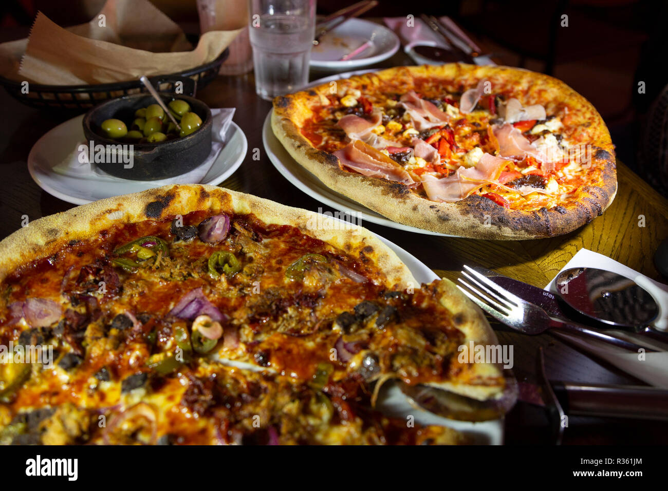 Pizzas on a table in a pizza restaurant Stock Photo - Alamy