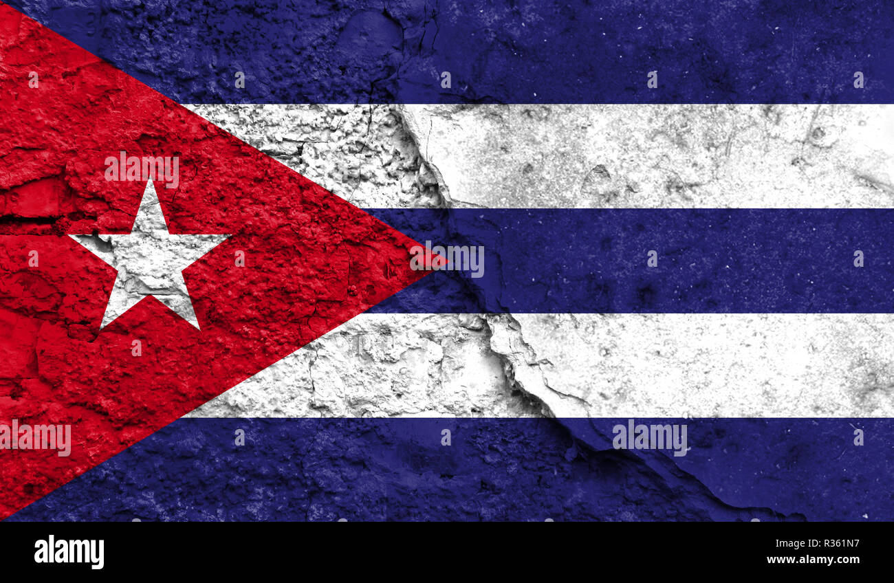 Flag of Cuba close up painted on a cracked wall, concept of armed ...