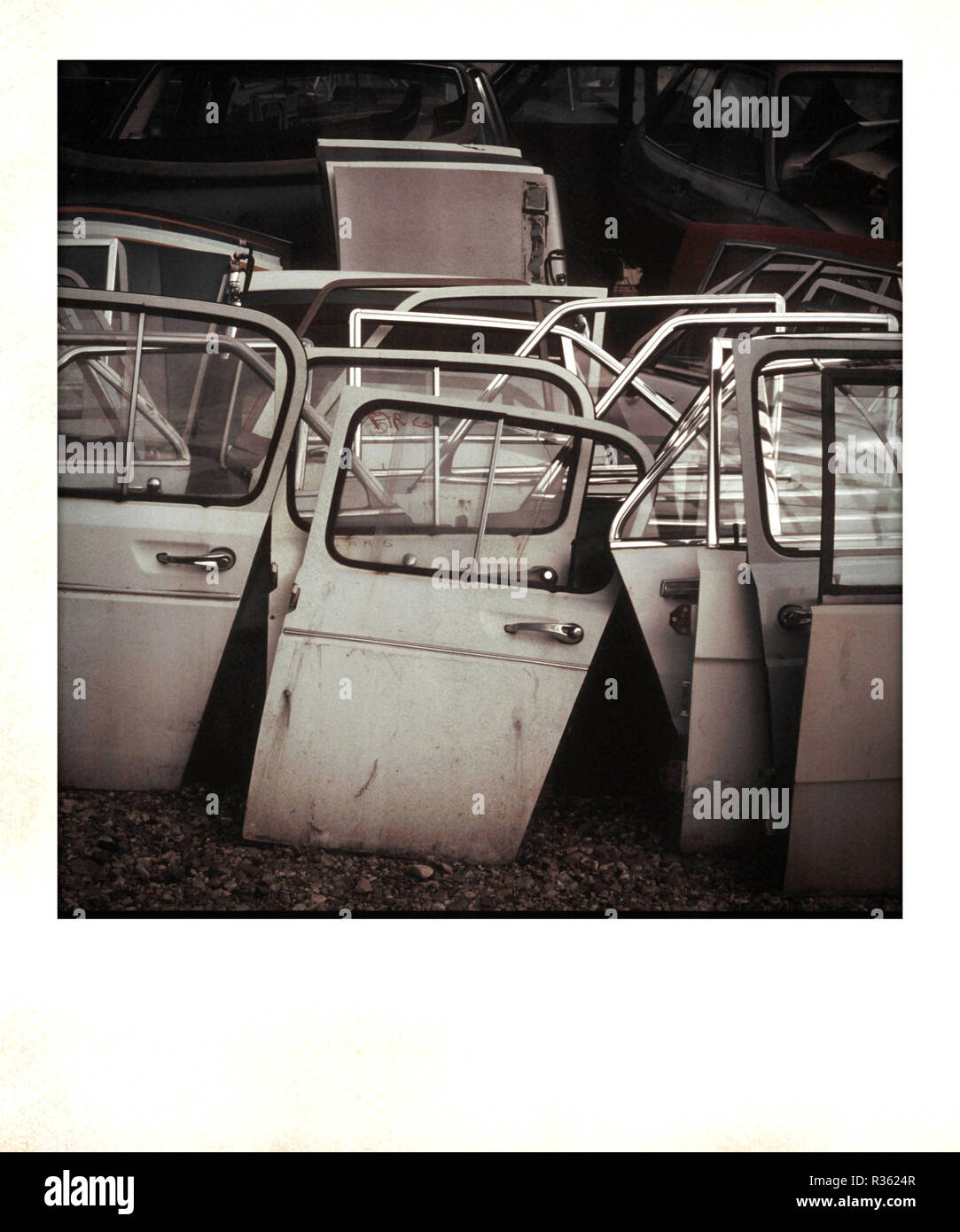 Photograph of car doors in a junk yard Stock Photo - Alamy