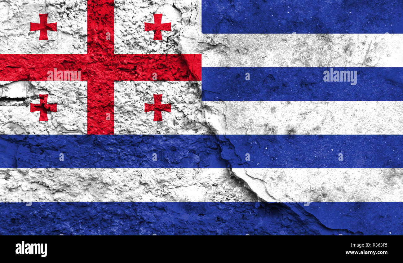 Flag of Adjara close up painted on a cracked wall, concept of armed ...