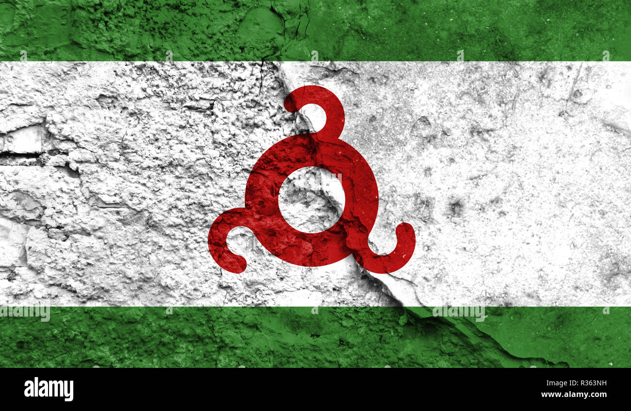Flag of Ingushetia close up painted on a cracked wall, concept of armed ...