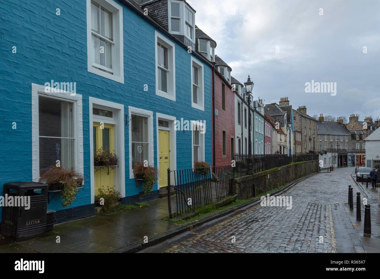 Brightly coloured terraced houses on a cobbled street in South ...