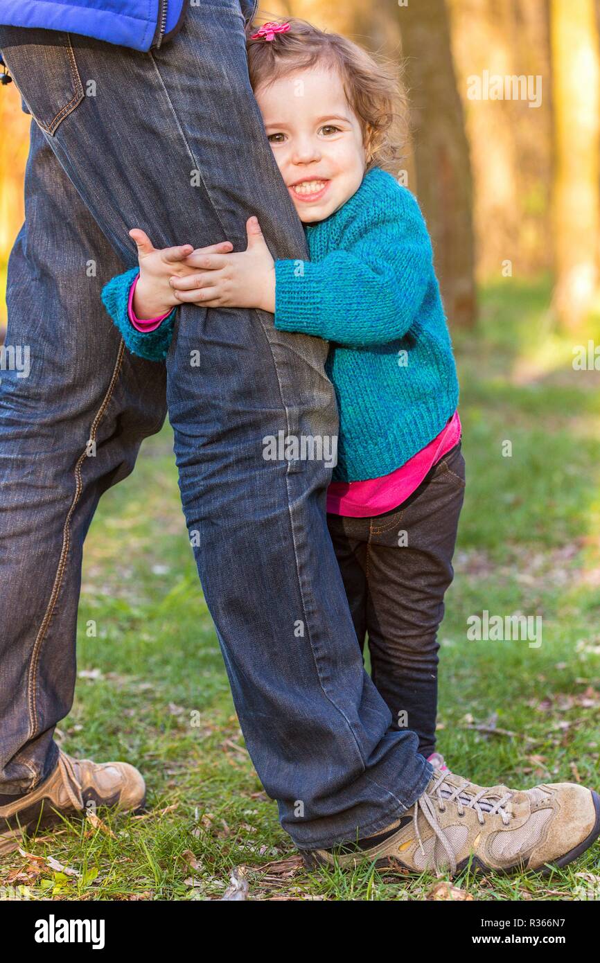 Child hugging leg hi-res stock photography and images - Alamy