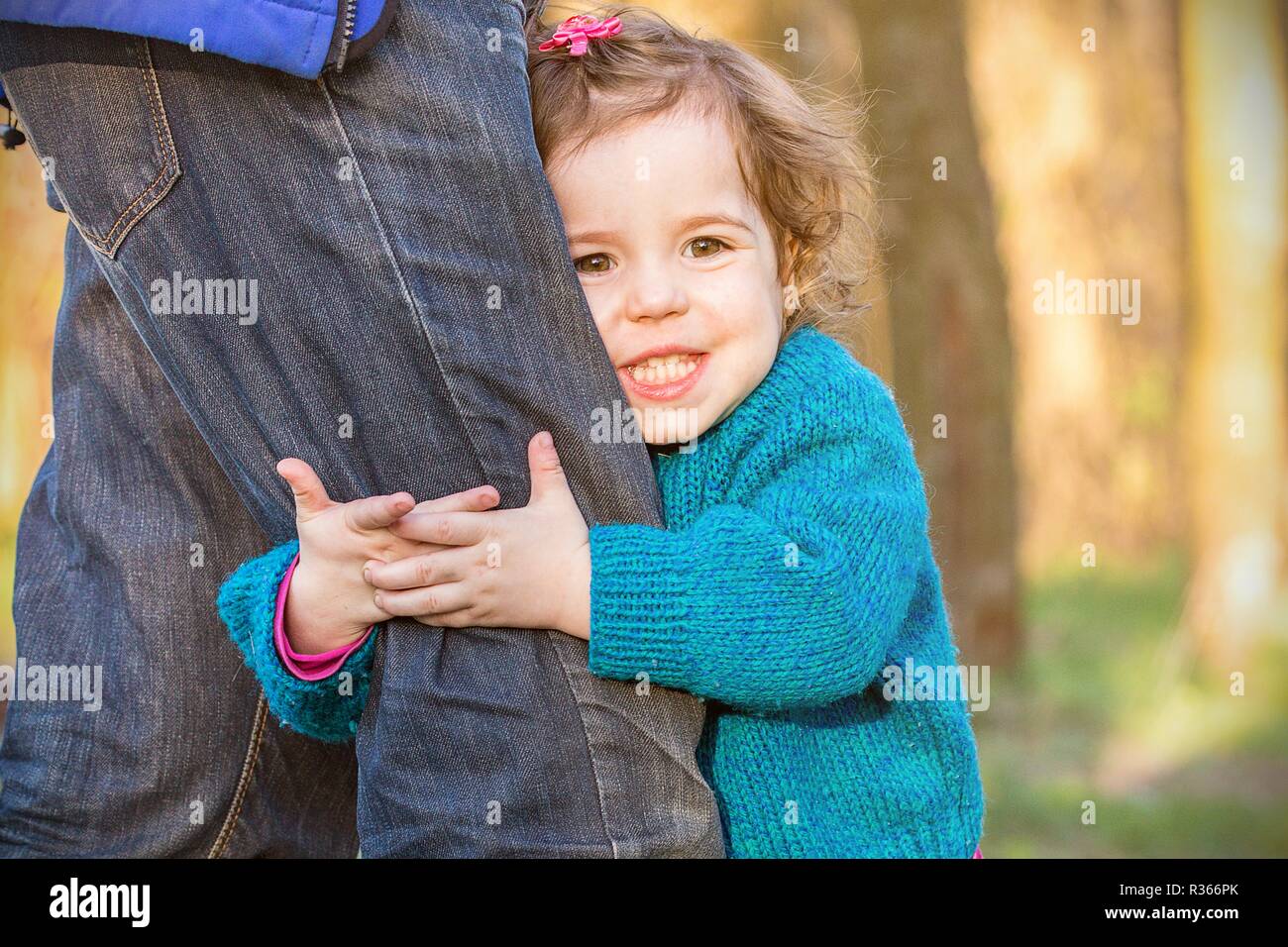 Child hugging leg hi-res stock photography and images - Alamy