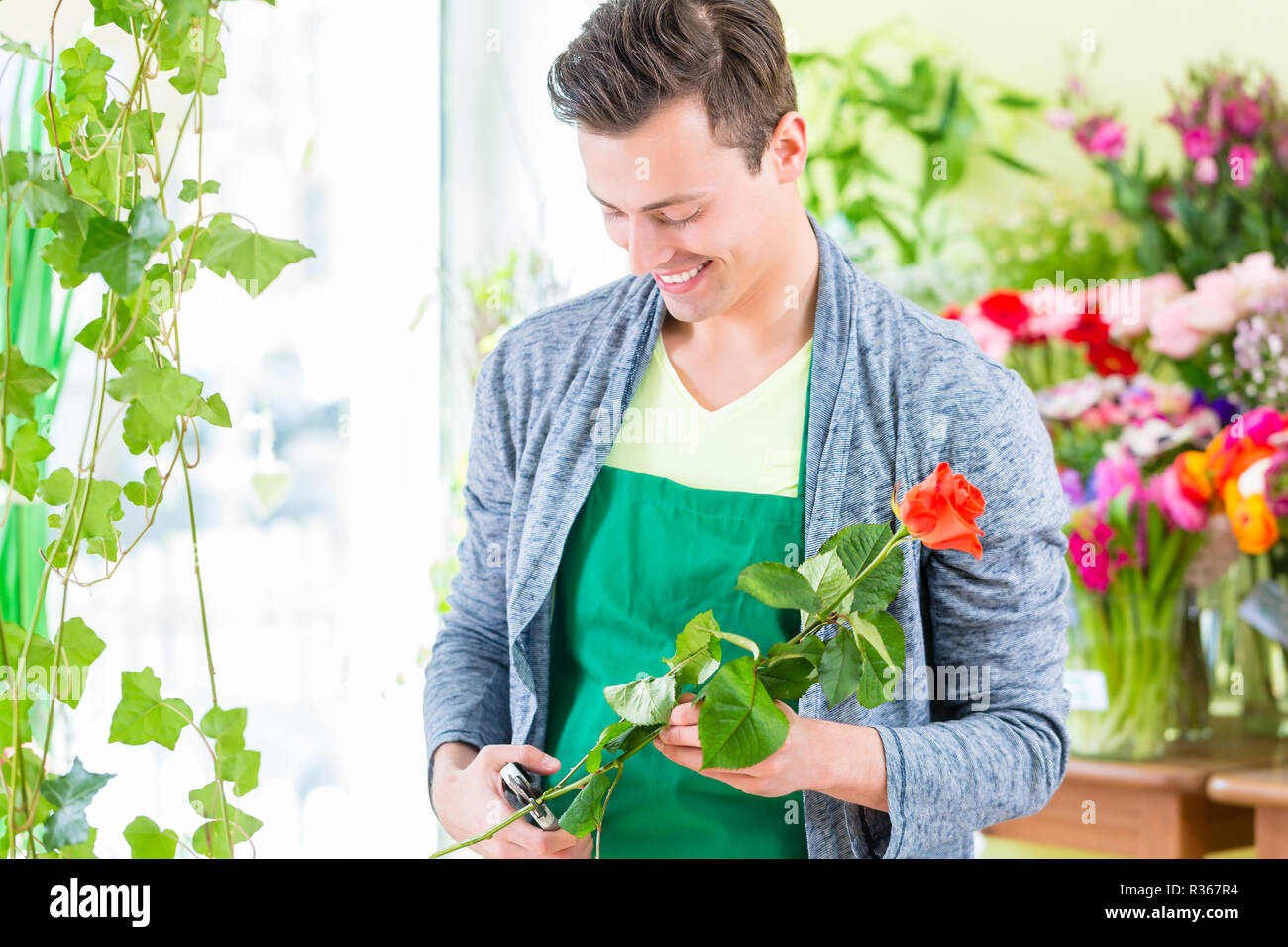 Nice flower shop worker hi-res stock photography and images - Alamy