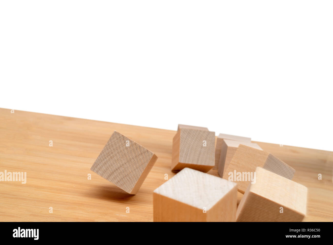 Wooden cubes roll on an inclined plane Stock Photo - Alamy