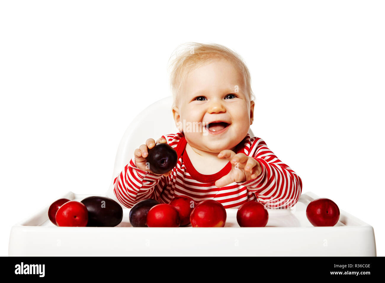 baby is selecting plums Stock Photo - Alamy