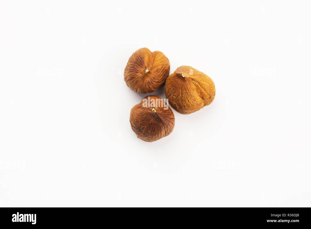 scattered hazelnut on white background Stock Photo - Alamy