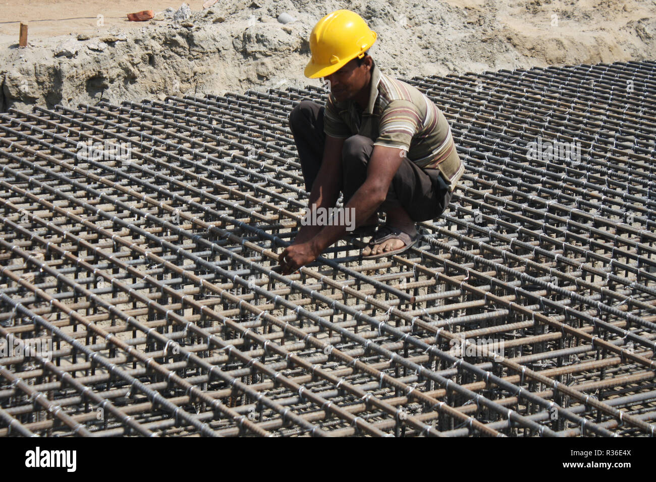 A Bangladeshi labor works in a Construction site in Dhaka, Bangladesh ...