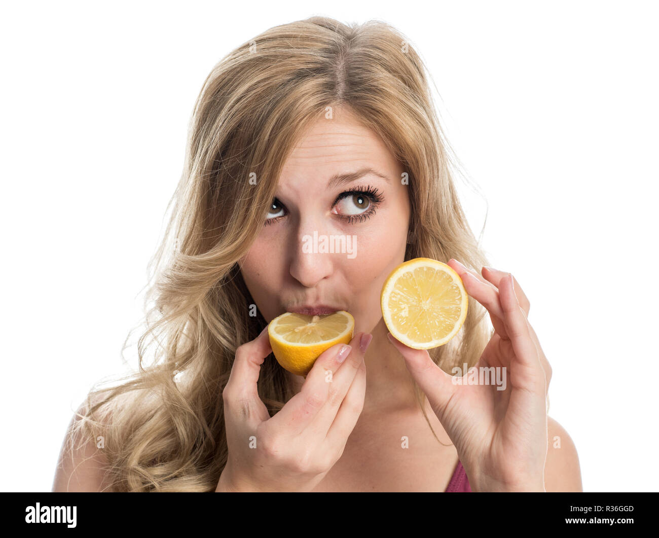 woman biting into lemon Stock Photo - Alamy
