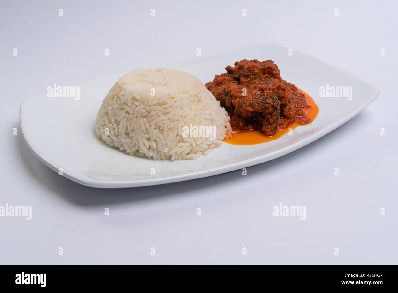 White rice and stew Stock Photo - Alamy