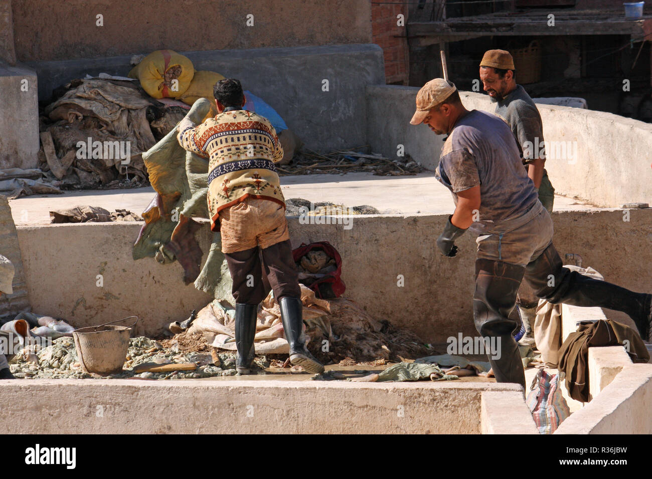 Marrakech, Morocco - September 20, 2012: Workers in a tannery prepare ...