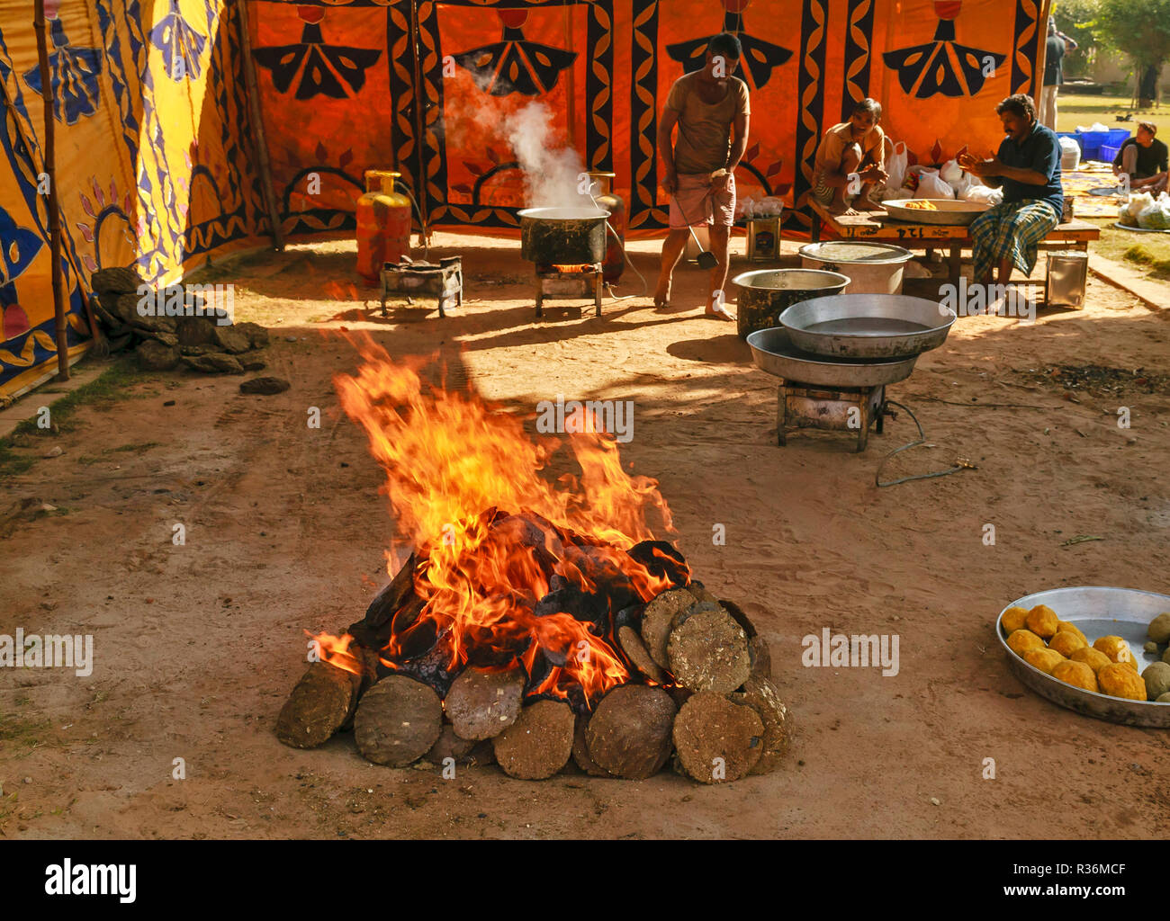 RAJASTHAN INDIA COOKS AND COOKING AREA AND AN OPEN FIRE OF SUN DRIED ...