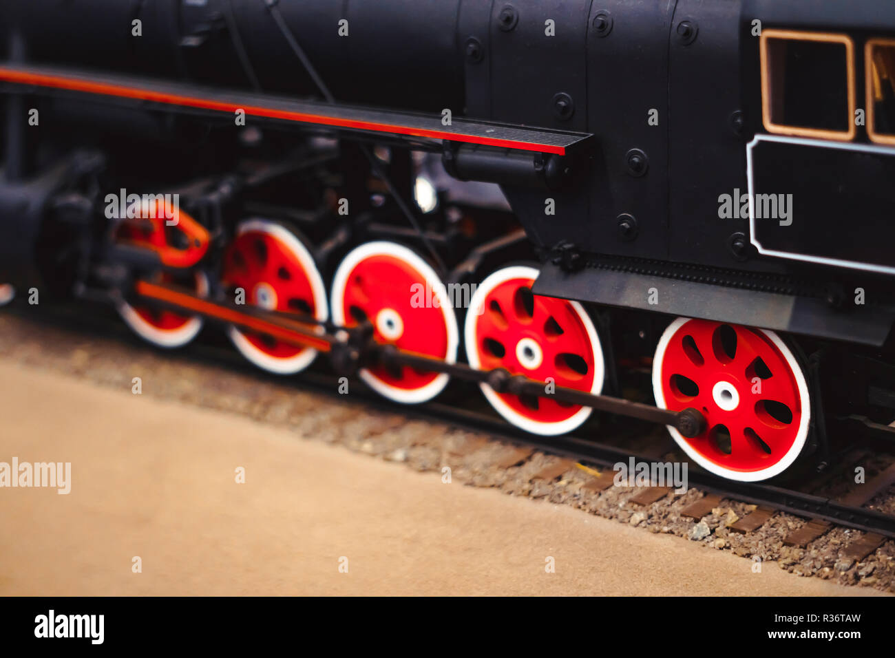 Black model Locomotive on track layout with headlamp Stock Photo - Alamy