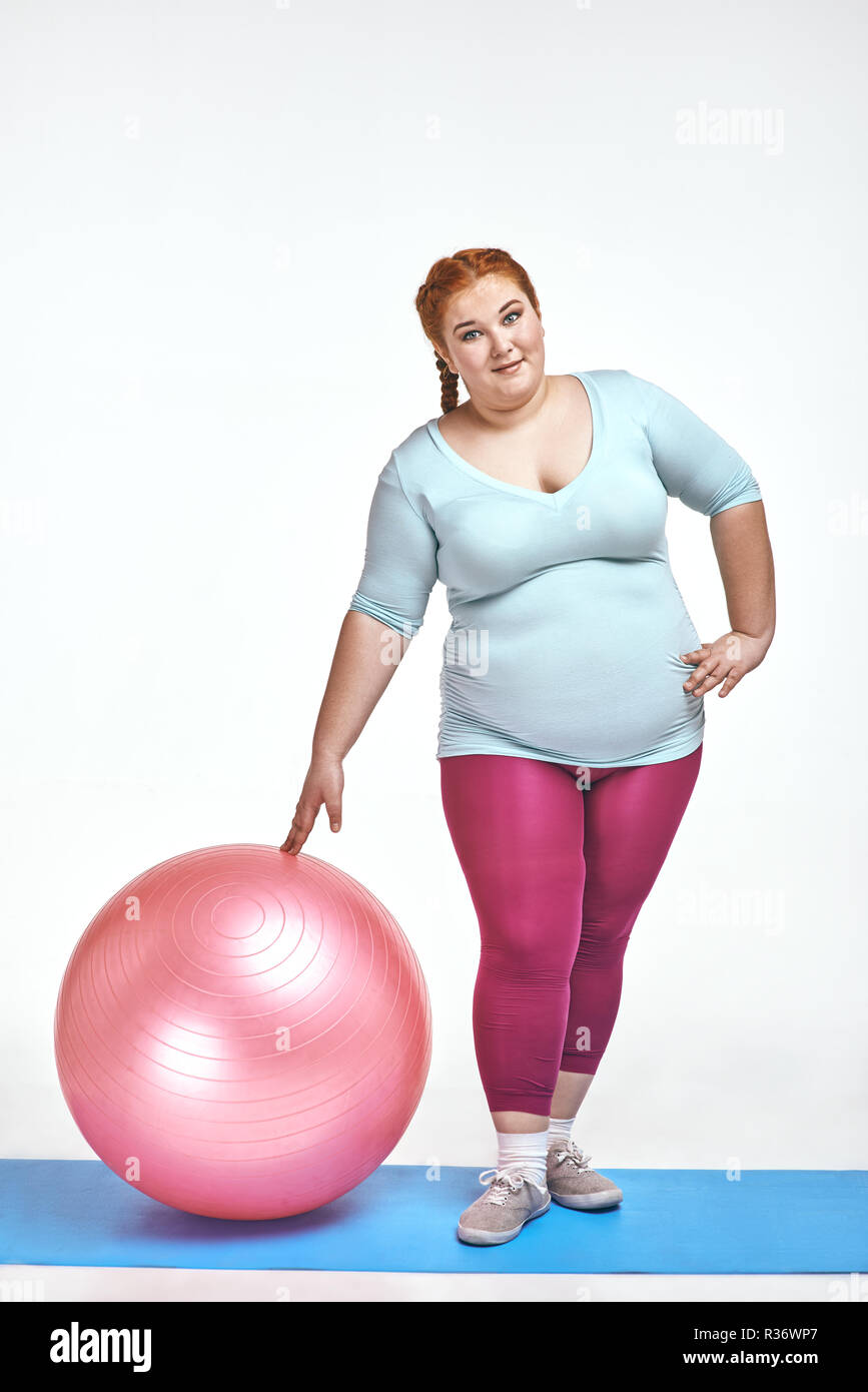 Funny picture of amusing, red haired, chubby woman which is holding a ...