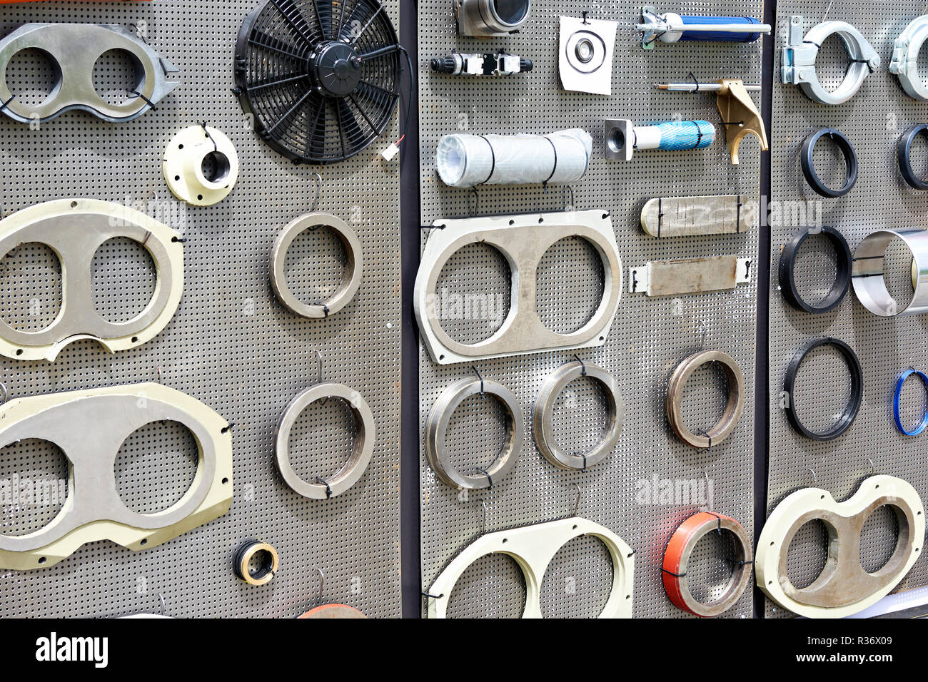 Spare parts for construction machinery on stand Stock Photo - Alamy