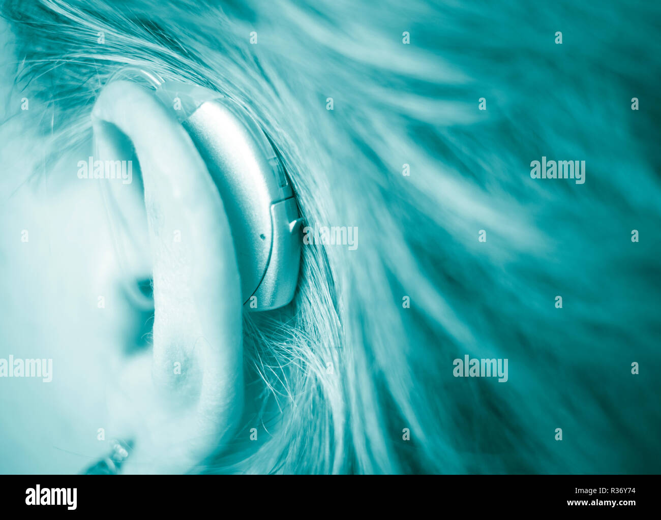 Deaf lady with modern technology digital hearing aid in her ear Stock ...